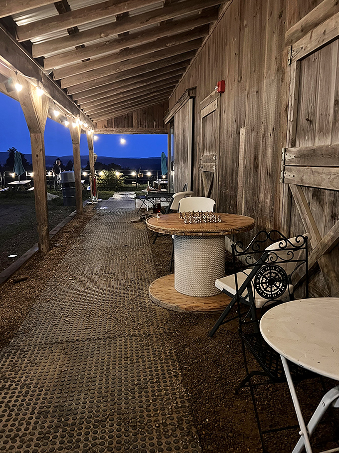 Evening magic under string lights&mdash;where summer nights become memories. Chess optional, but contemplating life's goodness is mandatory.