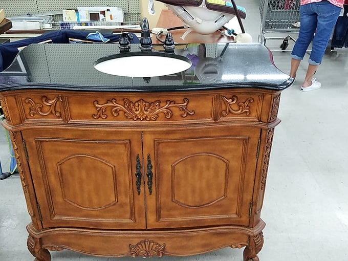Ornate meets elegant in this bathroom vanity that screams "I was expensive once and still am!" Baroque bargain-hunting at its finest.