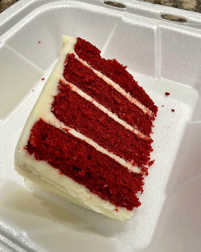 Four glorious layers of red velvet cake with cream cheese frosting so thick it could qualify as its own food group.