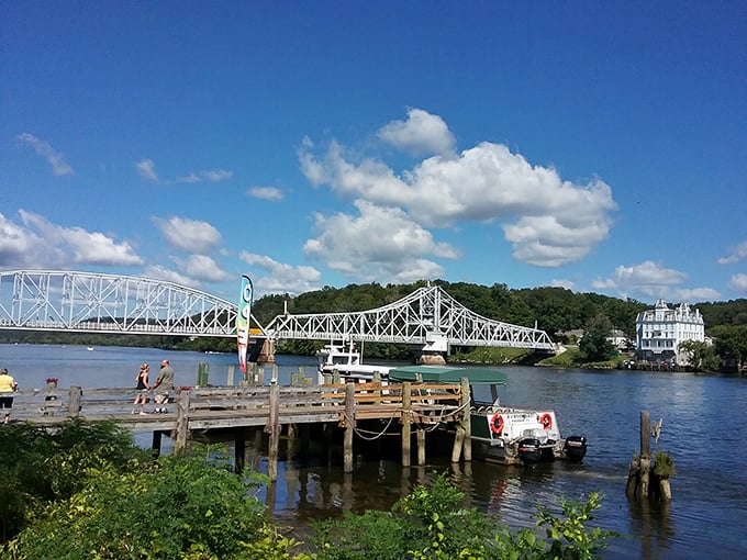 The Connecticut River Bridge frames a perfect day on the water. Boaters, paddlers, and dreamers converge where engineering marvel meets natural splendor.