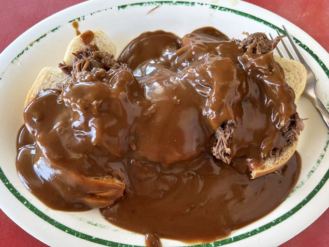 This isn't just a roast beef sandwich—it's a gravy delivery system that happens to include bread and meat. Napkins: mandatory.