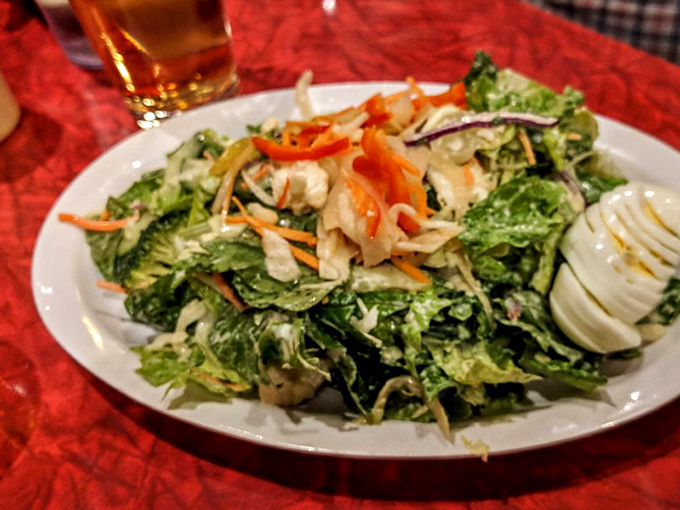 An open kitchen that invites you to witness the choreography of cooking. The sizzle and smoke are all part of the show. 