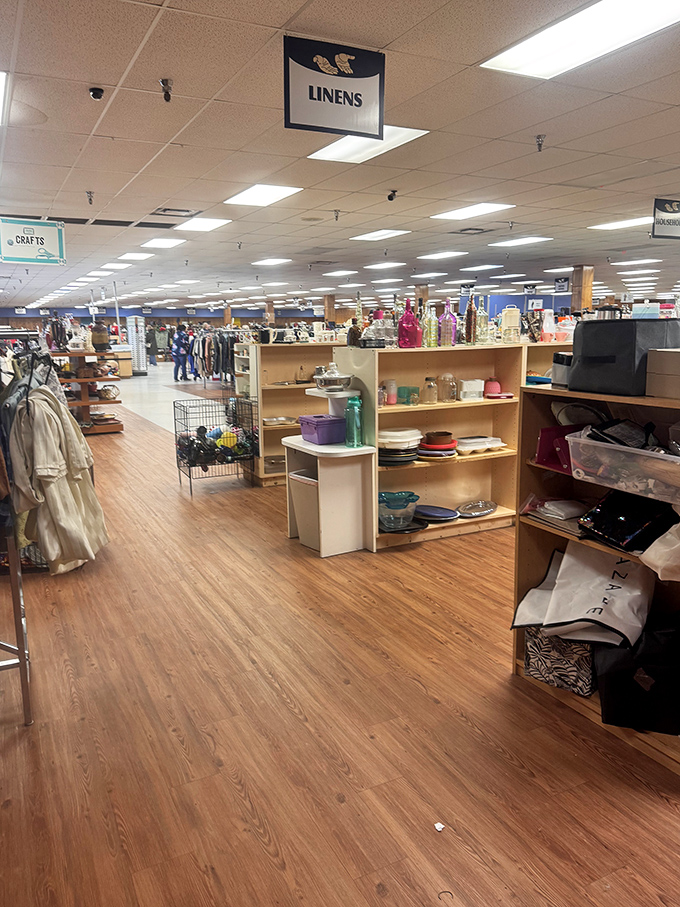 The linens section stretches into the distance, a textile wonderland where yesterday's tablecloths become tomorrow's creative projects.