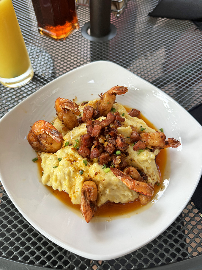 Shrimp and grits that would make a Southerner nod in approval – creamy, savory, and worth every calorie-laden spoonful.