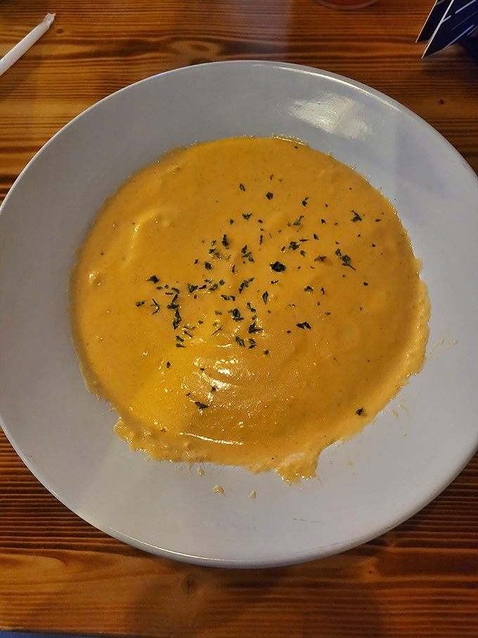 A bowl of liquid gold that proves soup can be both comfort food and a culinary achievement worthy of your undivided attention.