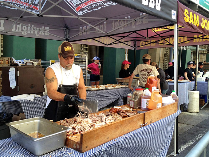 Masters of meat at work, their hands moving with the confidence that comes from thousands of hogs and decades of practice.