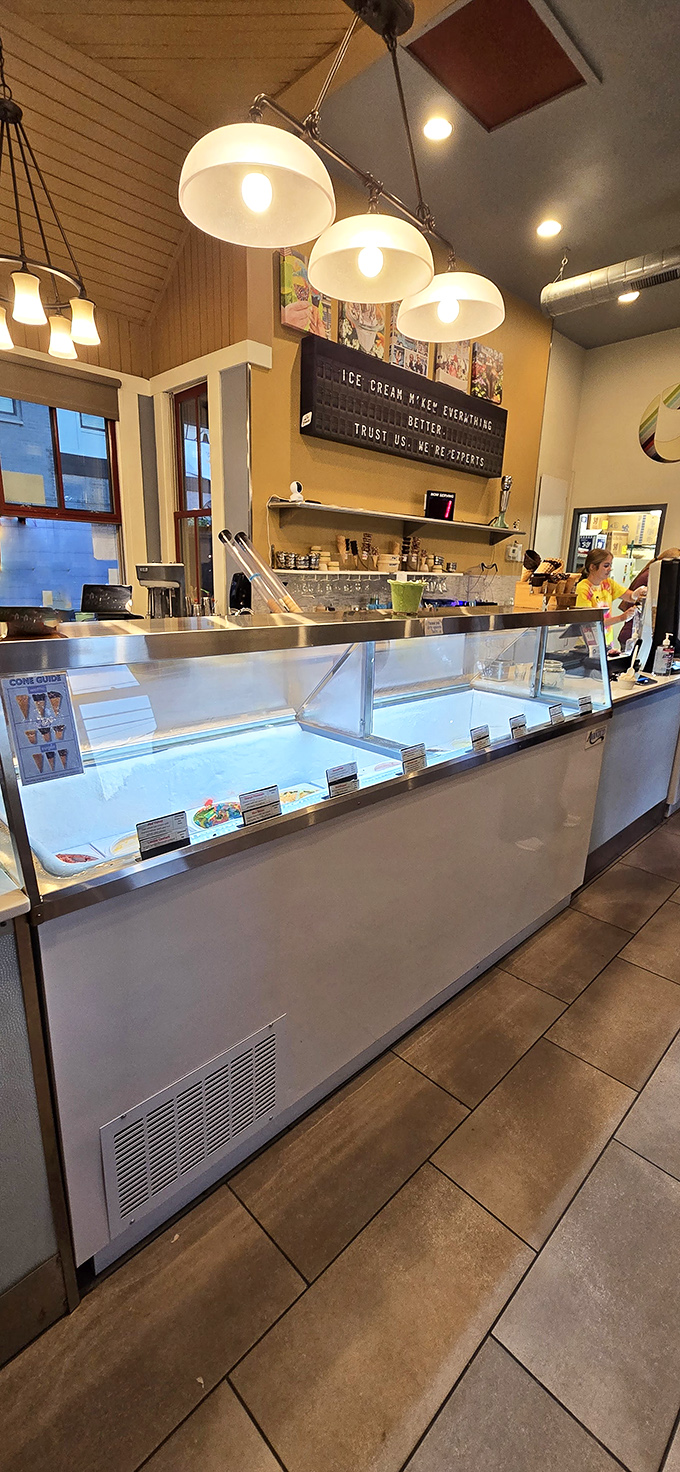 Behind that counter lies the laboratory where dairy dreams become reality, presided over by skilled ice cream artisans.