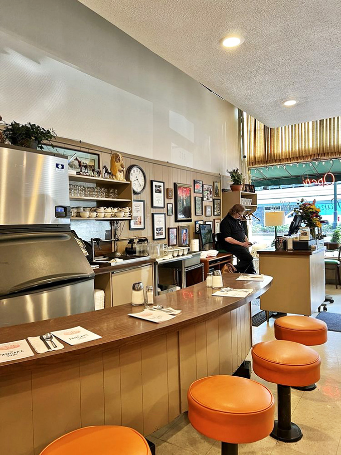 Where breakfast magic happens&mdash;the counter view reveals the command center of morning happiness, complete with those classic orange stools.