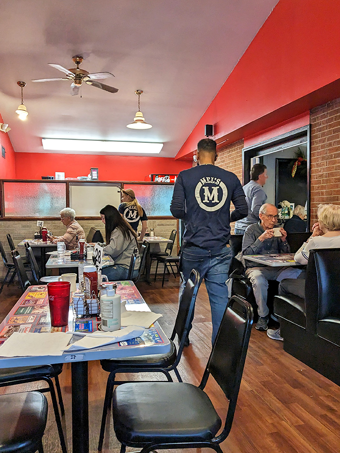 Where servers don't just take orders, they're unofficial ambassadors of Mel's hospitality, proudly wearing the team colors.