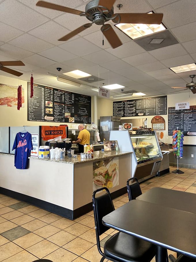 Where the magic happens: the deli counter adorned with sports memorabilia. These folks take their meats as seriously as New Yorkers take their teams.