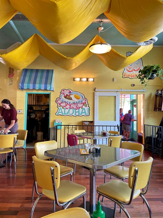 "Mahalo Nui Aloha!" proclaims the wall. Because nothing says "good morning" quite like a tropical greeting and fabric draped from the ceiling.