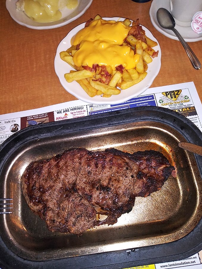 A steak that means business alongside cheese fries that don't ask permission to be indulgent. Pure diner magic. 