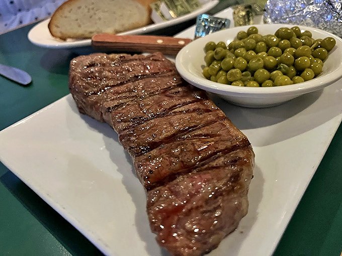 This steak isn't just cooked&mdash;it's been persuaded to perfection, with those grill marks telling tales of flame-kissed glory. 