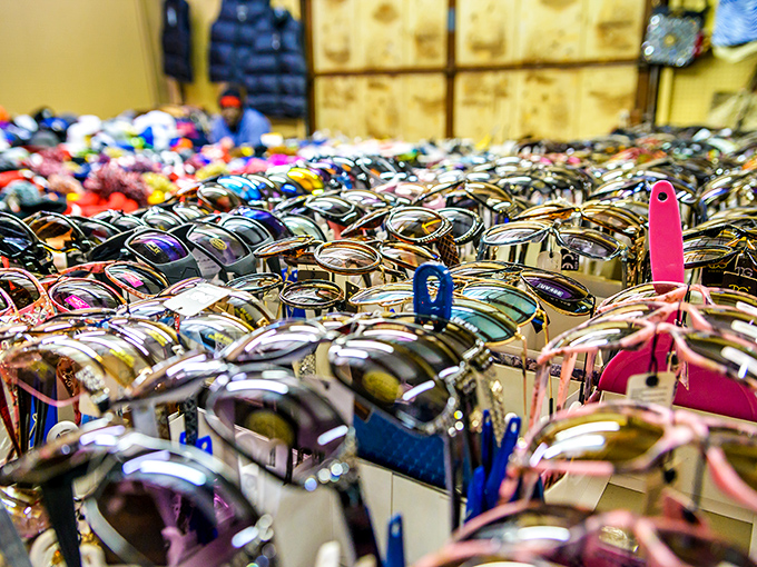 A sea of sunglasses creates a shimmering mosaic of style possibilities. Finding your perfect pair is like a treasure hunt with instant rewards.