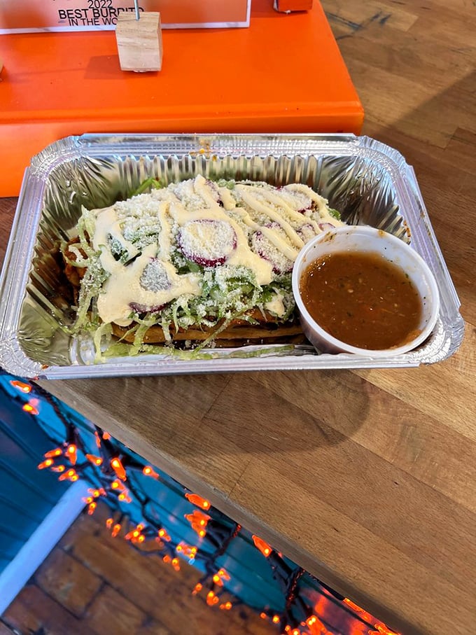 This taco special comes adorned like edible artwork. The accompanying soup offers a comforting contrast to the main attraction's bold flavors.