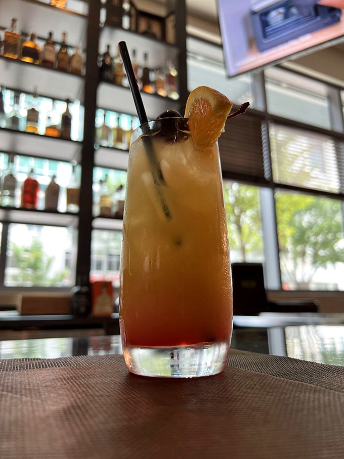 This cocktail doesn't just refresh &ndash; it tells a story with its sunset colors and garnish that's practically waving hello from the rim.