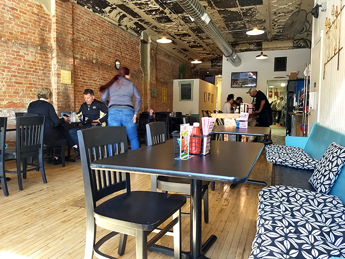 Exposed brick walls and wooden floors &ndash; the architectural equivalent of rolling up your sleeves before digging into something wonderful.