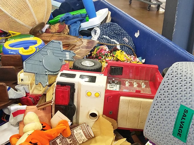 Vintage toys and childhood memories nestled together &ndash; that red toy kitchen probably served countless pretend meals before arriving here.