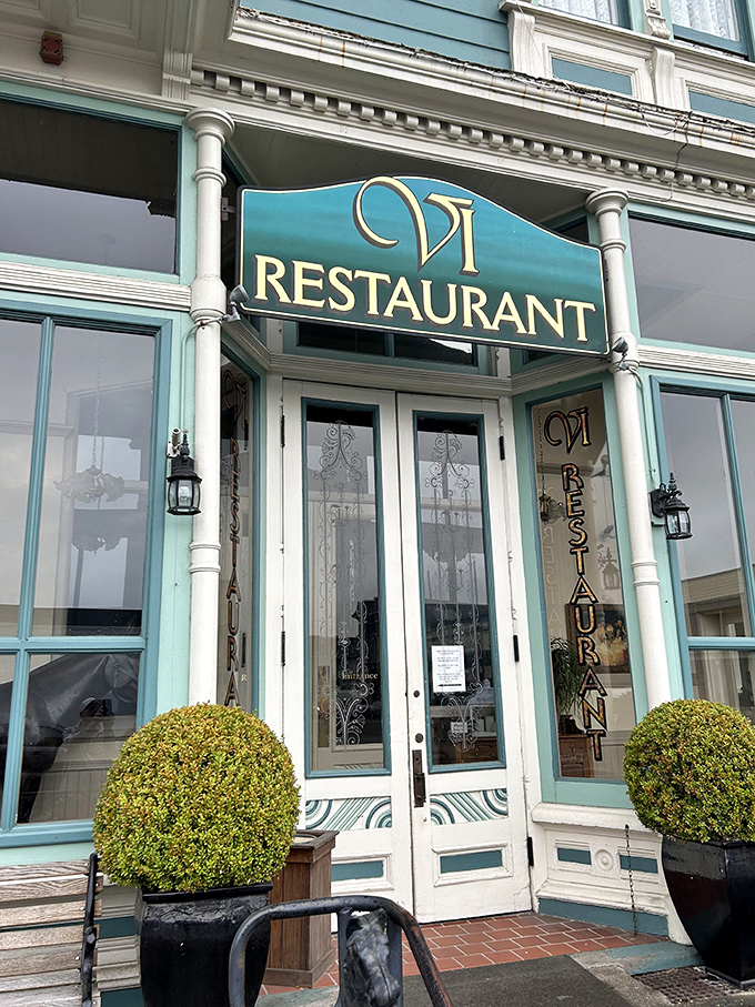 The VI Restaurant's elegant entrance promises a dining experience as refined as the Victorian architecture that houses it.