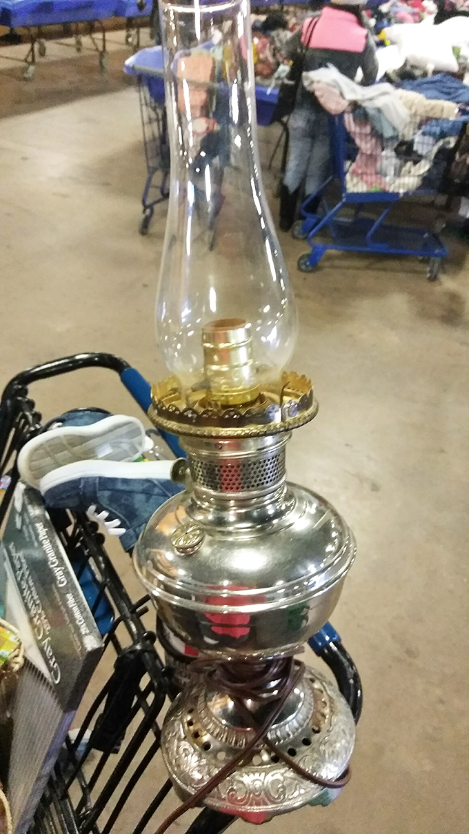 Hidden gems lurk in every corner. This vintage oil lamp could have illuminated conversations a century ago—now it awaits a new home and new stories.