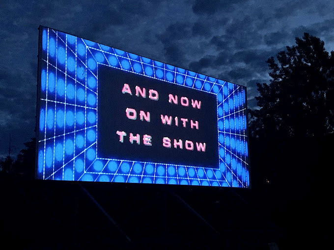 A single car claims its territory before the rush, like finding the perfect spot on the beach before the crowds arrive.