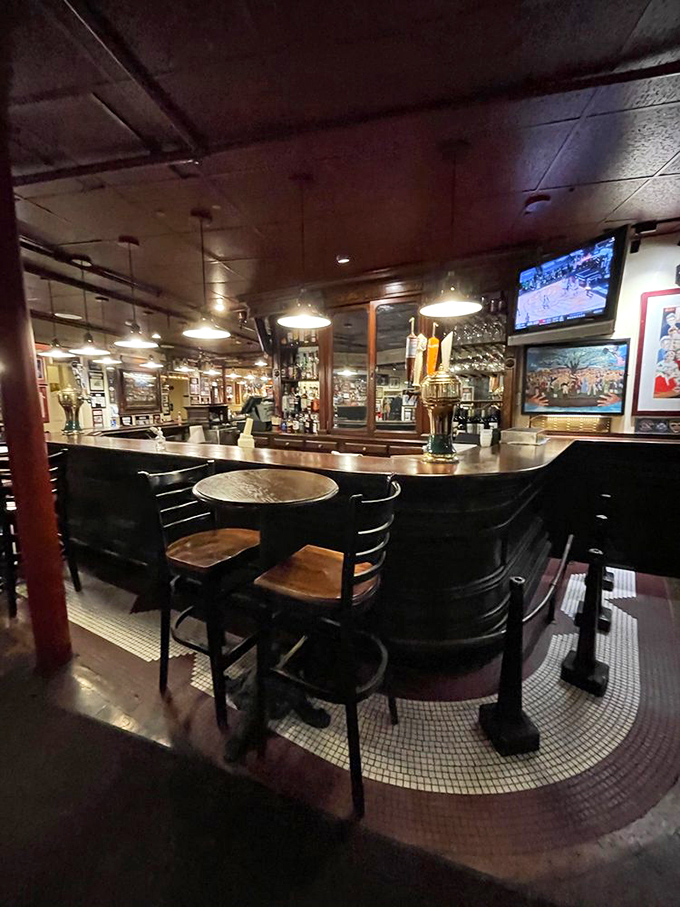 The curved wooden bar invites you to pull up a stool where countless Bostonians have contemplated oysters and life's big decisions since before photography existed.