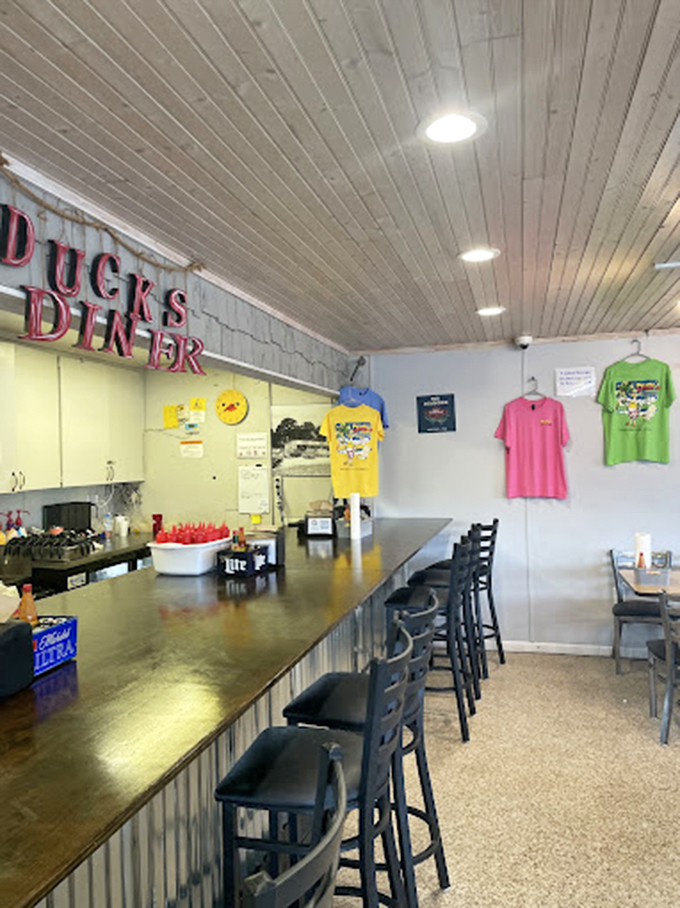 The counter seating area, where solo diners become temporary neighbors and coffee refills flow like conversation at this Gulf Shores institution.