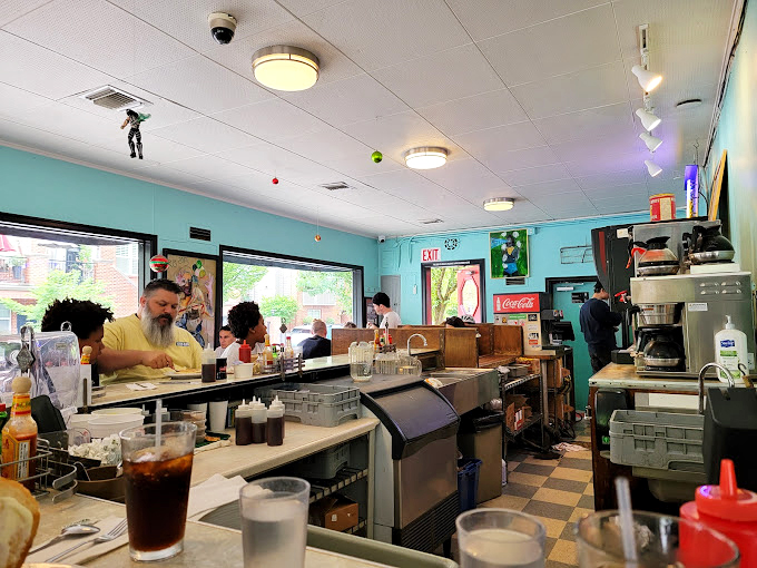 The mint-colored walls and classic diner layout create a time capsule where calories don't count and coffee refills are practically mandatory.