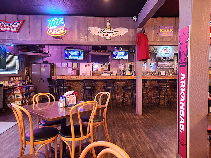 The bar area serves as Crazee's social hub, where cold beer flows and Arkansas sports victories (and defeats) are celebrated equally.