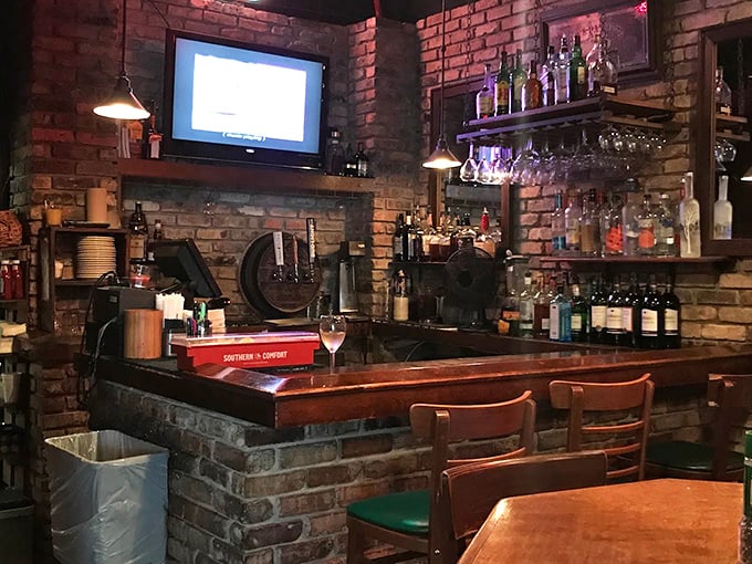 The bar feels like it's been there forever &ndash; brick walls, polished wood, and the promise of a perfectly mixed Manhattan while you wait for your table.