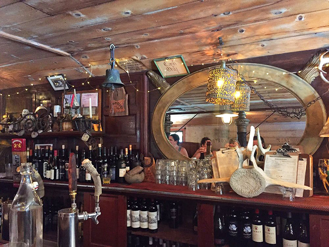 The bar that time forgot, in the best possible way. Every bottle, antler, and vintage mirror has earned its place in this rustic symphony.