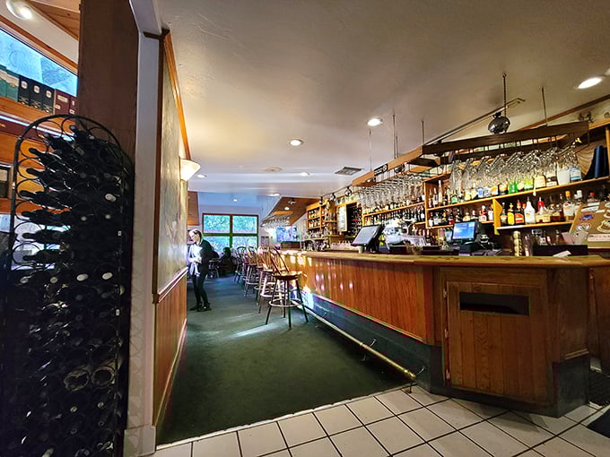 The bar: where wine bottles stand at attention, waiting for their moment to enhance your meal with liquid poetry.