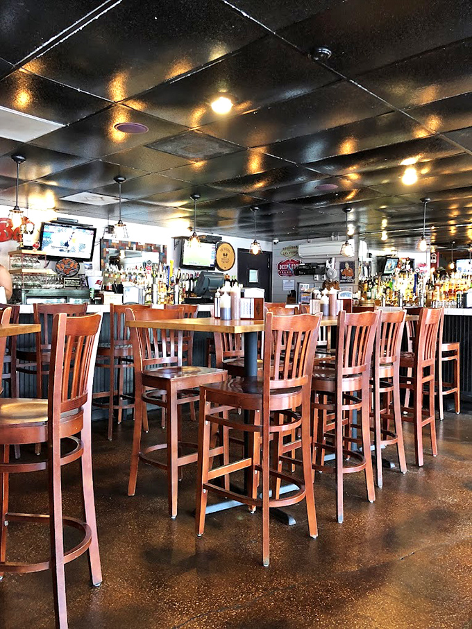 The bar area awaits the evening crowd. Those stools have heard more barbecue praise than a pitmaster's own mother.