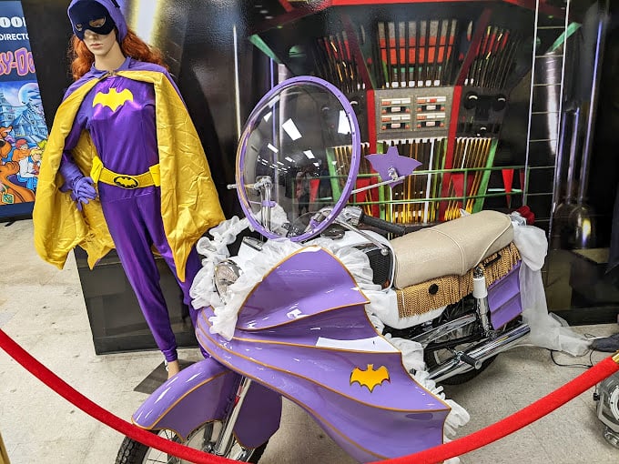 Batgirl's purple reign extends to her custom motorcycle, proving that fighting crime doesn't mean sacrificing style - even vigilantes appreciate a signature color scheme.