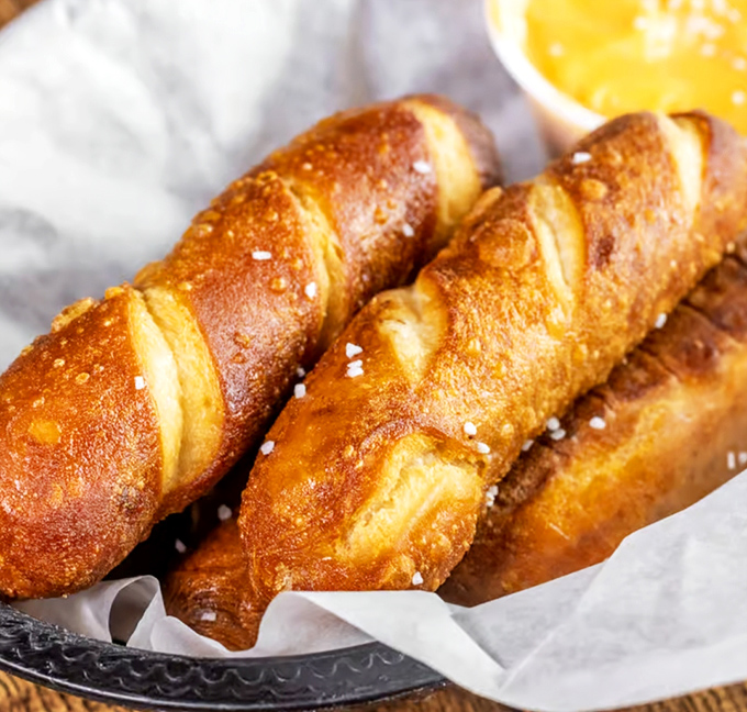 These pretzel buns aren't just bread&mdash;they're golden-brown works of art with a sprinkle of salt that catches the light like tiny diamonds.