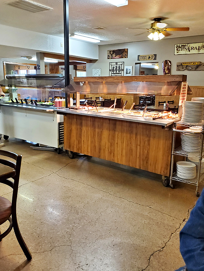 The buffet setup: where dreams are made and diets come to die. Each steam table promises a different journey into comfort food bliss.