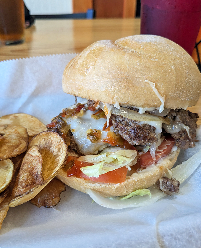 This isn't just a burger&mdash;it's a towering achievement of beef, cheese, and fresh toppings that demands both hands and your full attention.