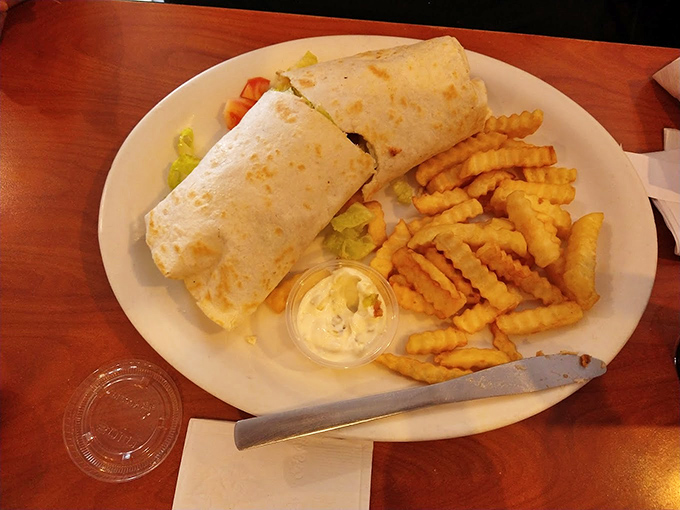 A burrito flanked by crinkle-cut fries&mdash;proof that culinary borders are meant to be crossed. Simple food executed with respect for tradition.