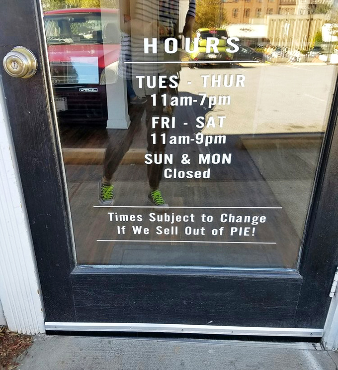 Hours posted with the most honest disclaimer in retail: "Times subject to change if we sell out of PIE!"