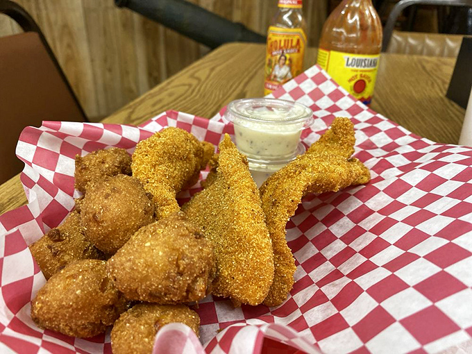 Cornmeal-crusted catfish and hush puppies that could make a fish-skeptic see the light. Southern comfort on a red checkered basket.