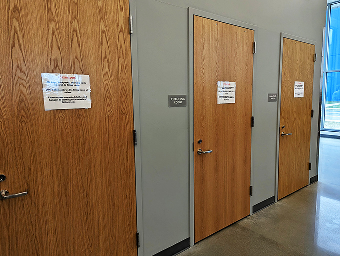 Even the changing rooms have a no-nonsense charm. These humble doors have witnessed countless "does this vintage jacket really work?" moments.