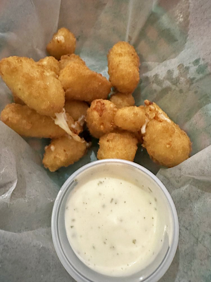 These cheese curds aren't just appetizers&mdash;they're little golden nuggets of joy that squeak their way into your heart.