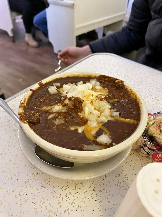Their chili arrives topped with diced onions like a warm, meaty swimming pool you'd gladly dive into headfirst on a cold Missouri day.