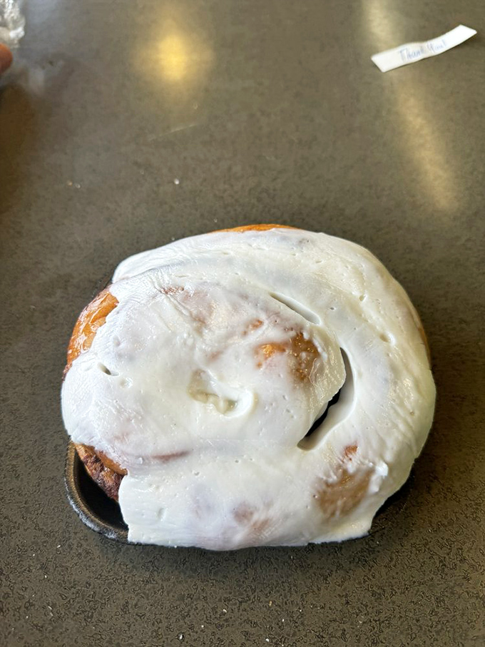 This cinnamon roll isn't just breakfast - it's therapy with frosting, a spiral of comfort that whispers "everything's gonna be okay."