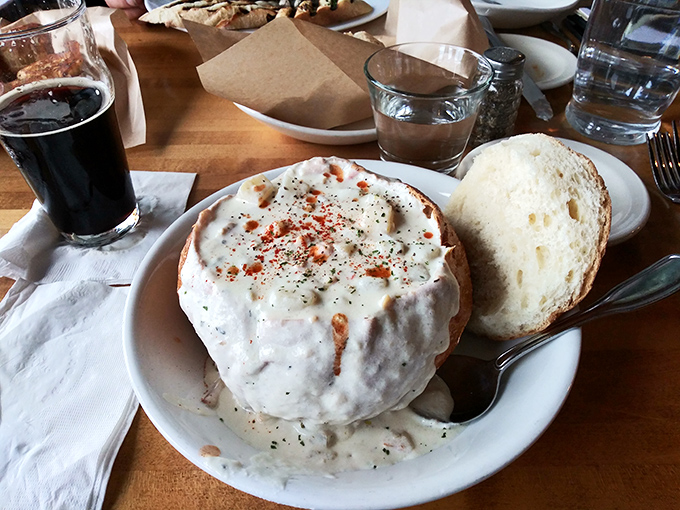 This isn't just clam chowder; it's a creamy ocean hug in a bowl, served with bread that's destined for a delicious dunking fate.
