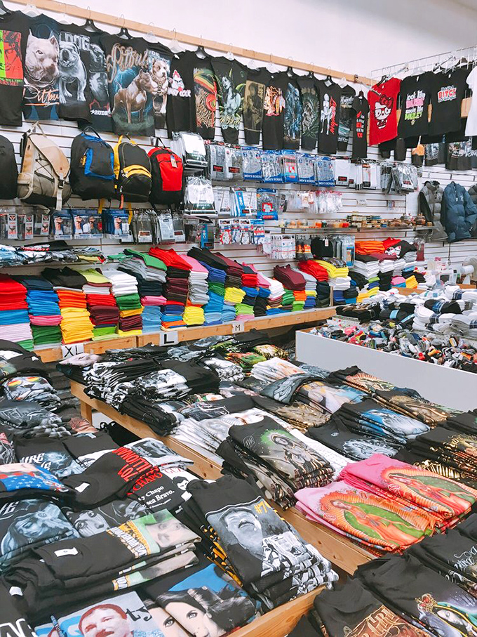 T-shirt taxonomy at its finest. Graphics range from pitbulls to pop icons, proving personal expression comes in all colors, sizes, and sleeve lengths.