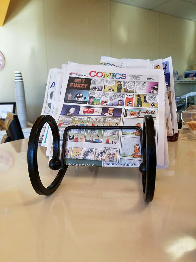 Even the newspaper rack shows thoughtful touches—comics first, because who needs world problems before you've had your waffle and coffee?