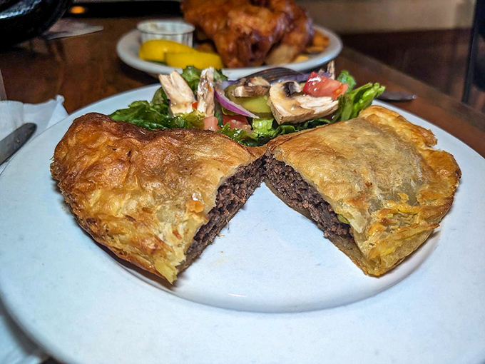 The Cornish pasty, split open to reveal its meaty soul&mdash;a hand-held feast that miners once carried underground and you'll want to carry everywhere.