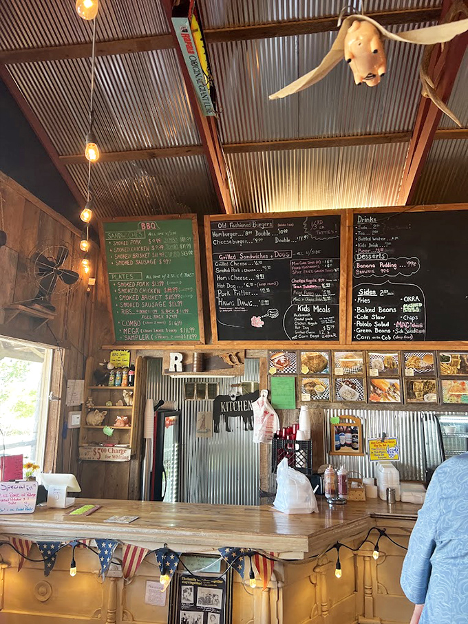 The order counter tells the whole story: handwritten menus, string lights, and absolutely zero pretension. Just how barbecue should be.