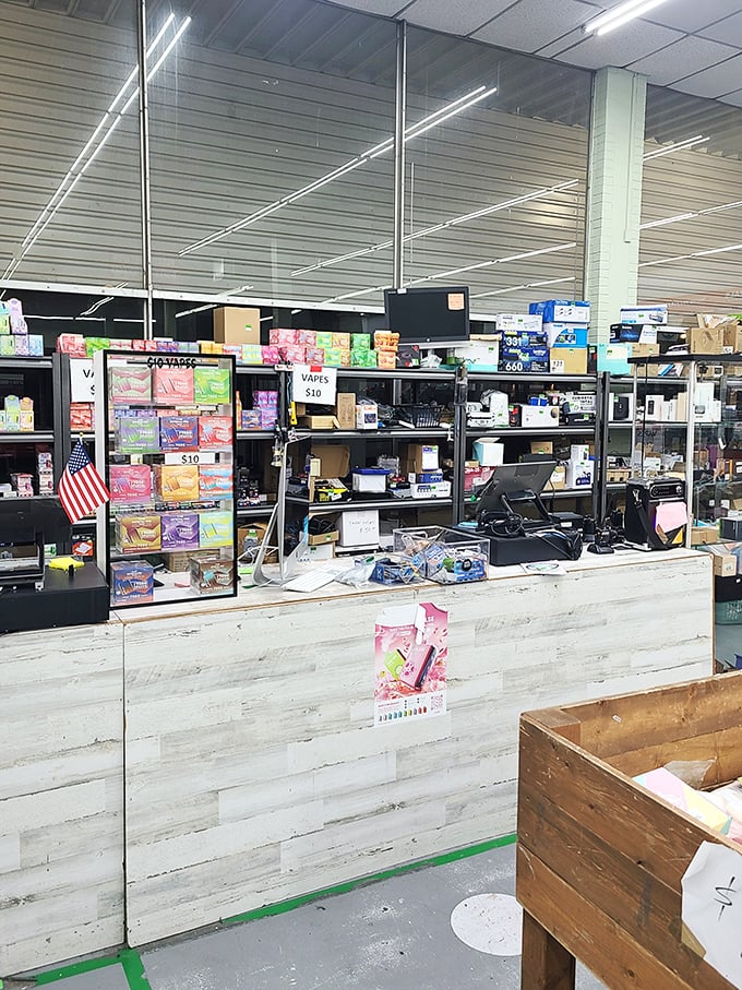 Behind the counter, treasures await their forever homes. The staff keeps the retail chaos surprisingly organized.